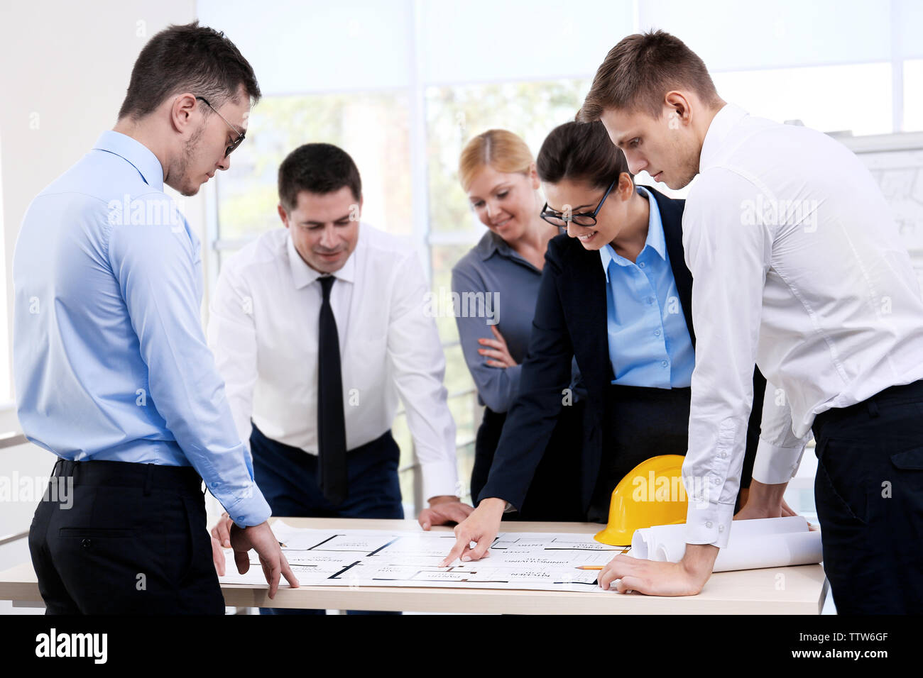 Group of creative engineers planning new project in office Stock Photo ...