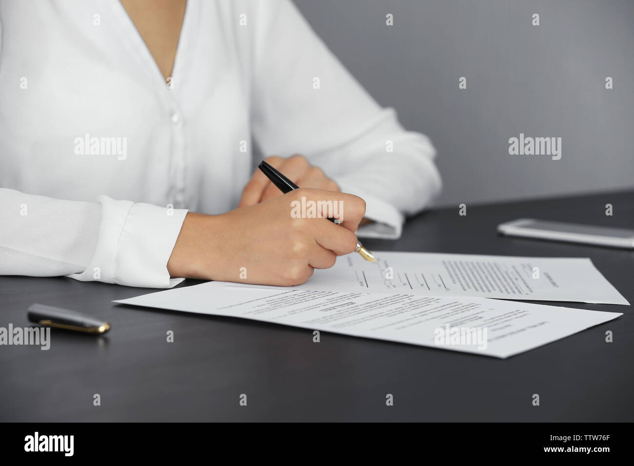 Woman signing last will and testament, closeup Stock Photo - Alamy