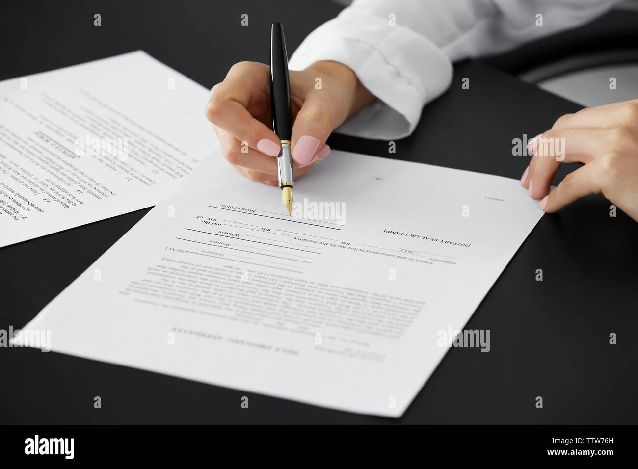 Woman signing last will and testament, closeup Stock Photo - Alamy