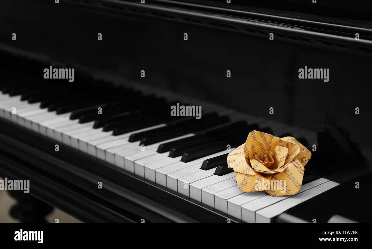 Rose made of music notes on piano keys Stock Photo - Alamy