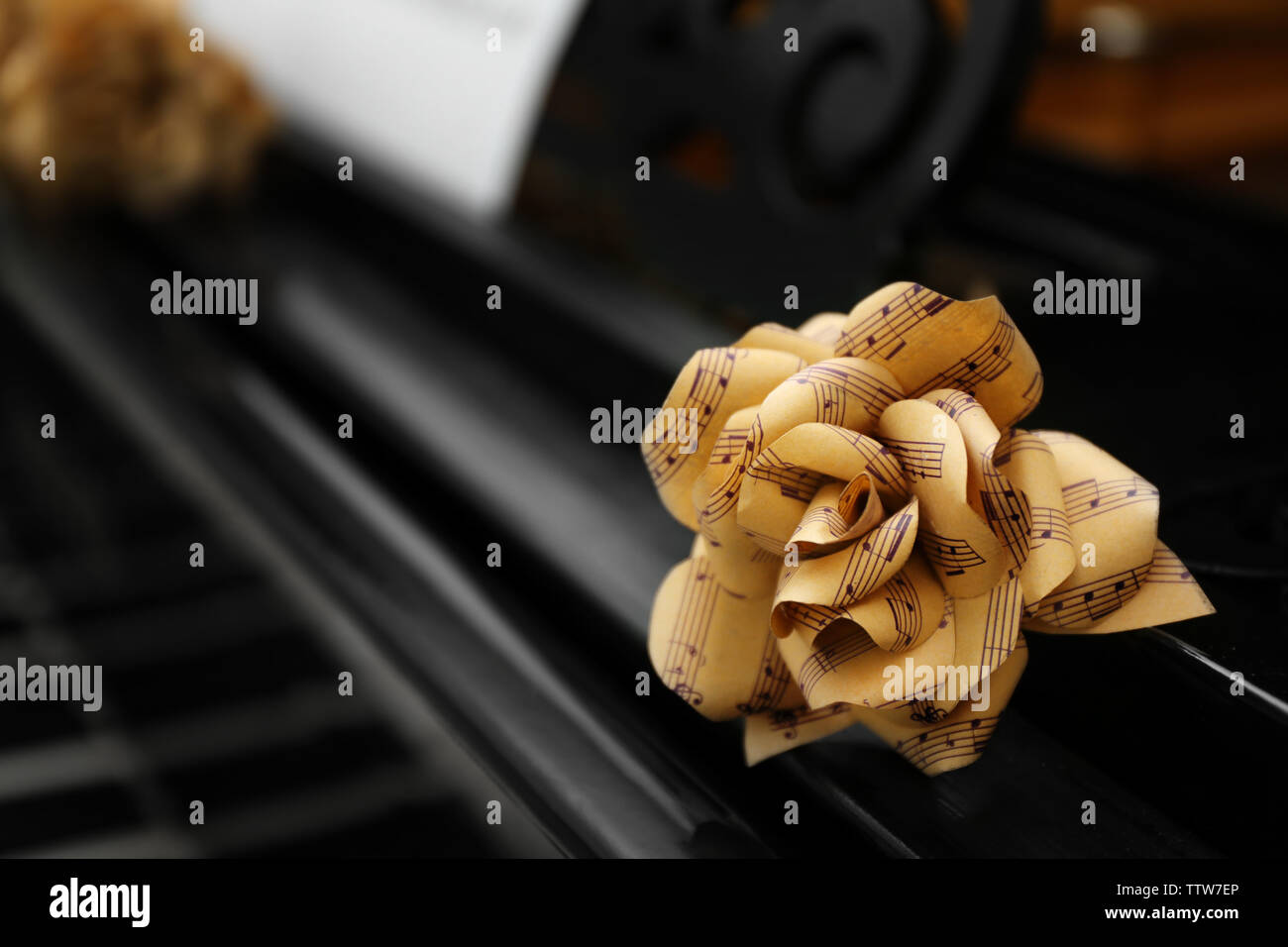 Rose made of music notes on black piano Stock Photo - Alamy