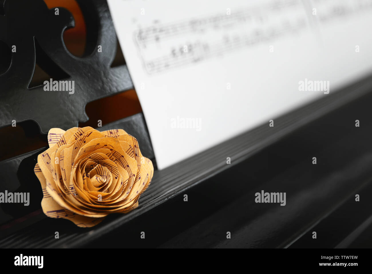 Rose made of music notes on black piano Stock Photo - Alamy