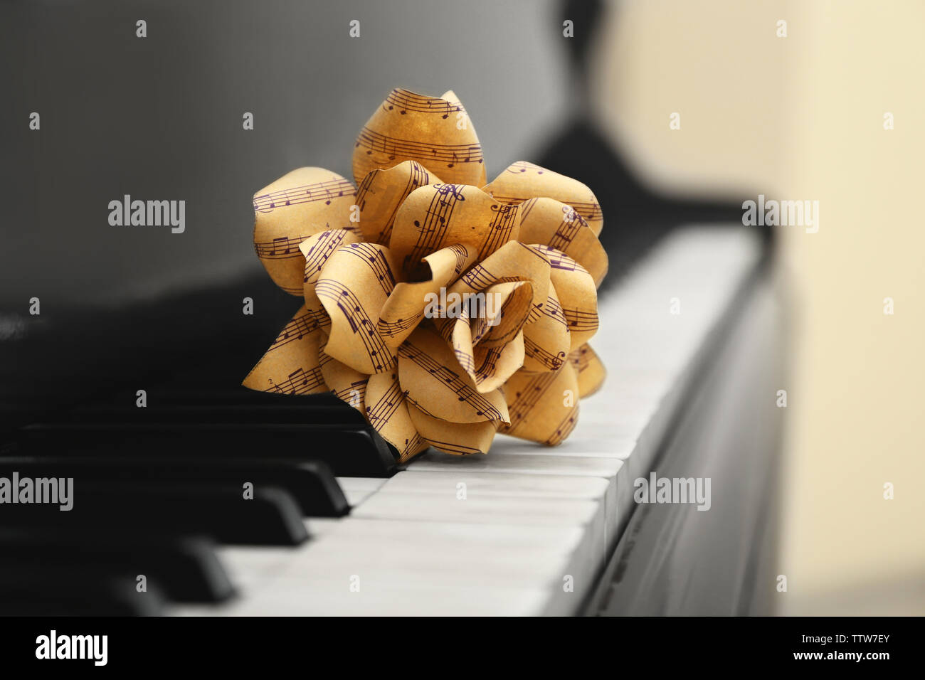 Rose made of music notes on piano keys Stock Photo - Alamy