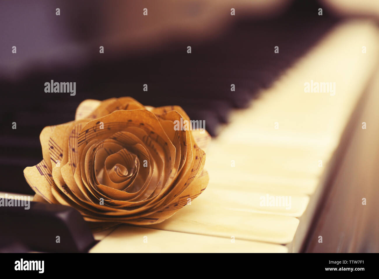 Rose made of music notes on piano keys Stock Photo - Alamy