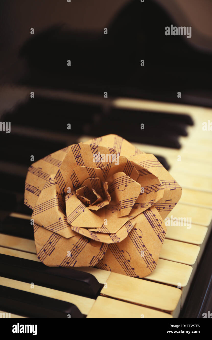 Rose made of music notes on piano keys Stock Photo - Alamy