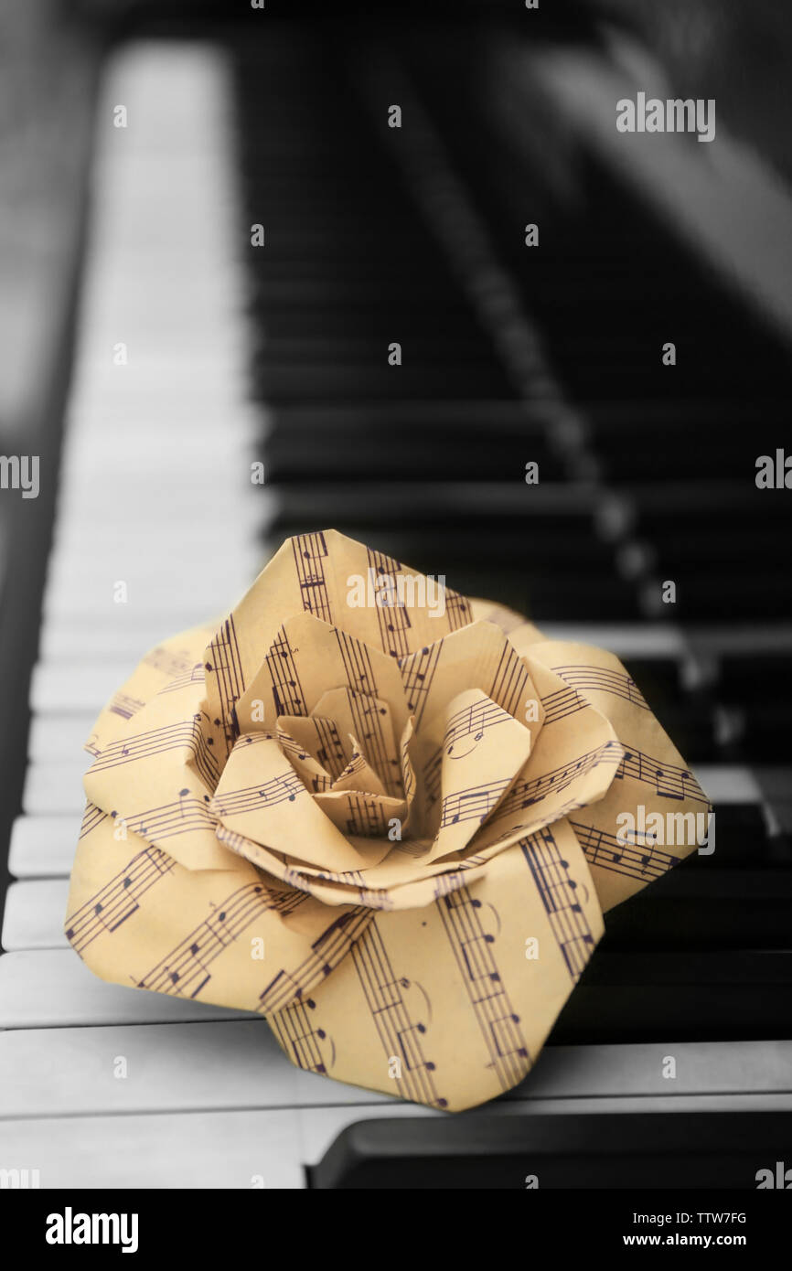 Rose made of music notes on piano keys Stock Photo - Alamy