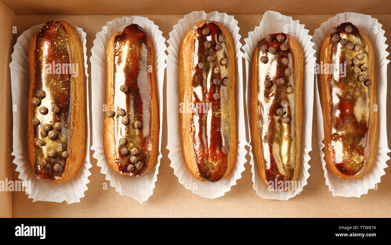 Delicious eclairs in cardboard box, top view Stock Photo - Alamy
