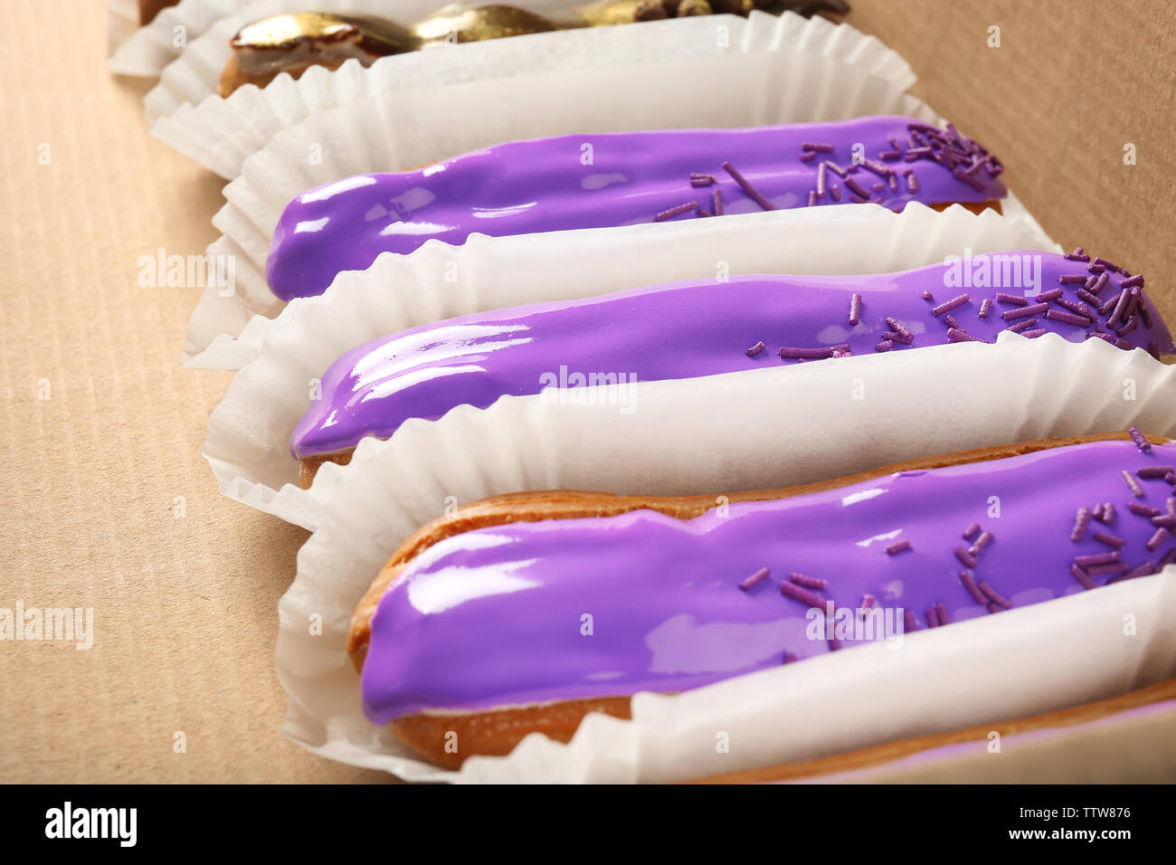 Delicious eclairs in cardboard box closeup Stock Photo - Alamy