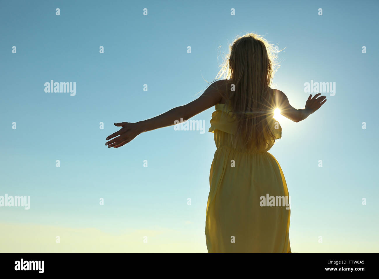 Female sky blue dress silhouette hi-res stock photography and images ...