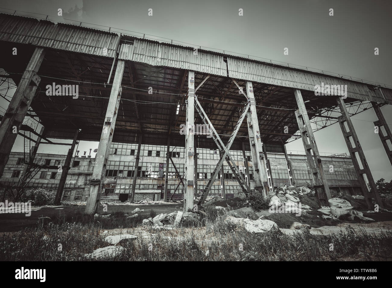 Old abandoned ruin factory damage building. View of the destroyed and ... Old abandoned ruin factory damage building. View of the destroyed and ...