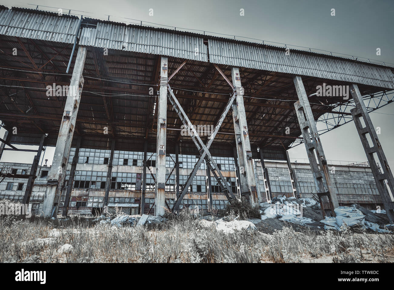 Old abandoned ruin factory damage building. View of the destroyed and ...