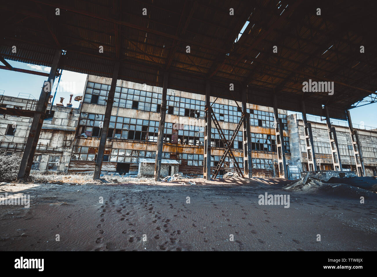 View of the destroyed building-the plant, around the black and purple ...
