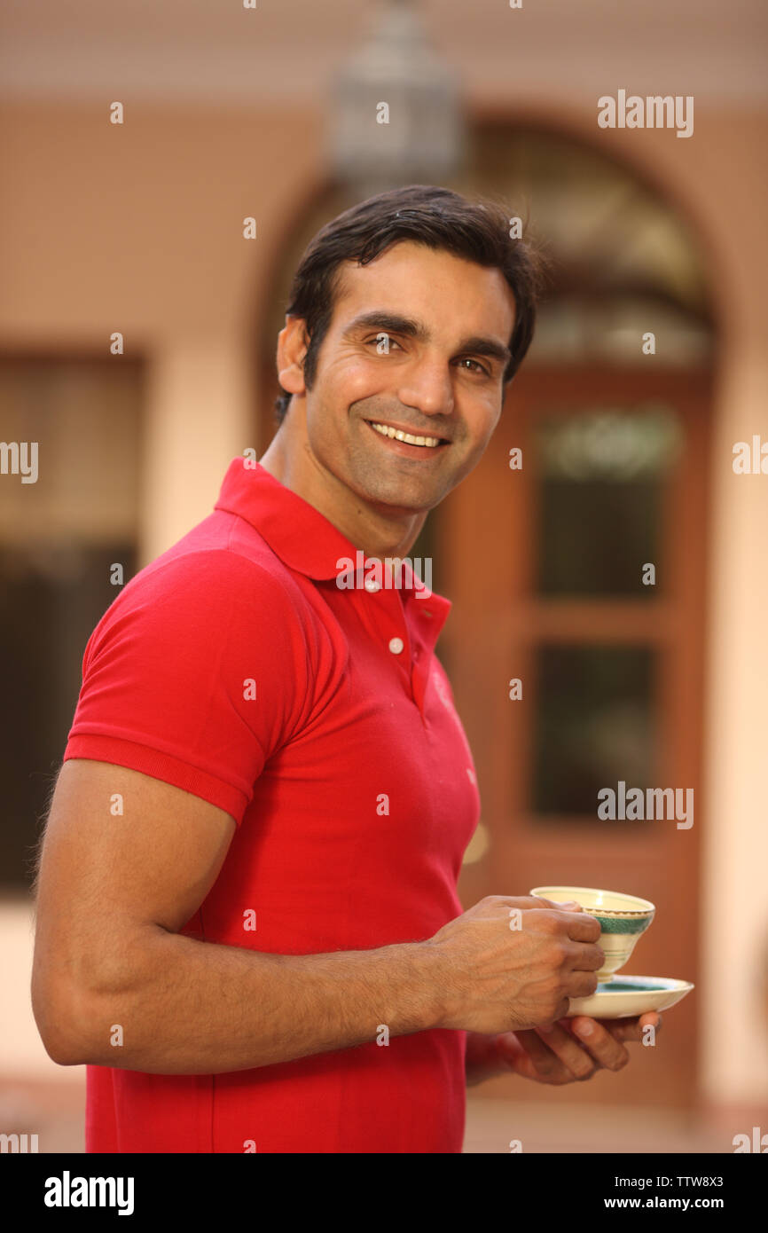 Portrait of a man having tea Stock Photo - Alamy
