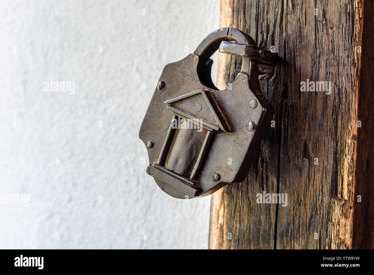 Interesting old padlock on a wooden medieval door. Vintage padlock ...