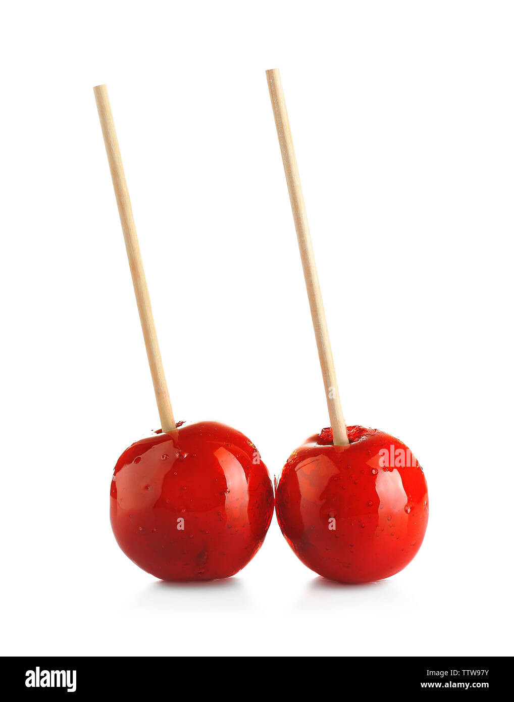Toffee apples on white background Stock Photo - Alamy