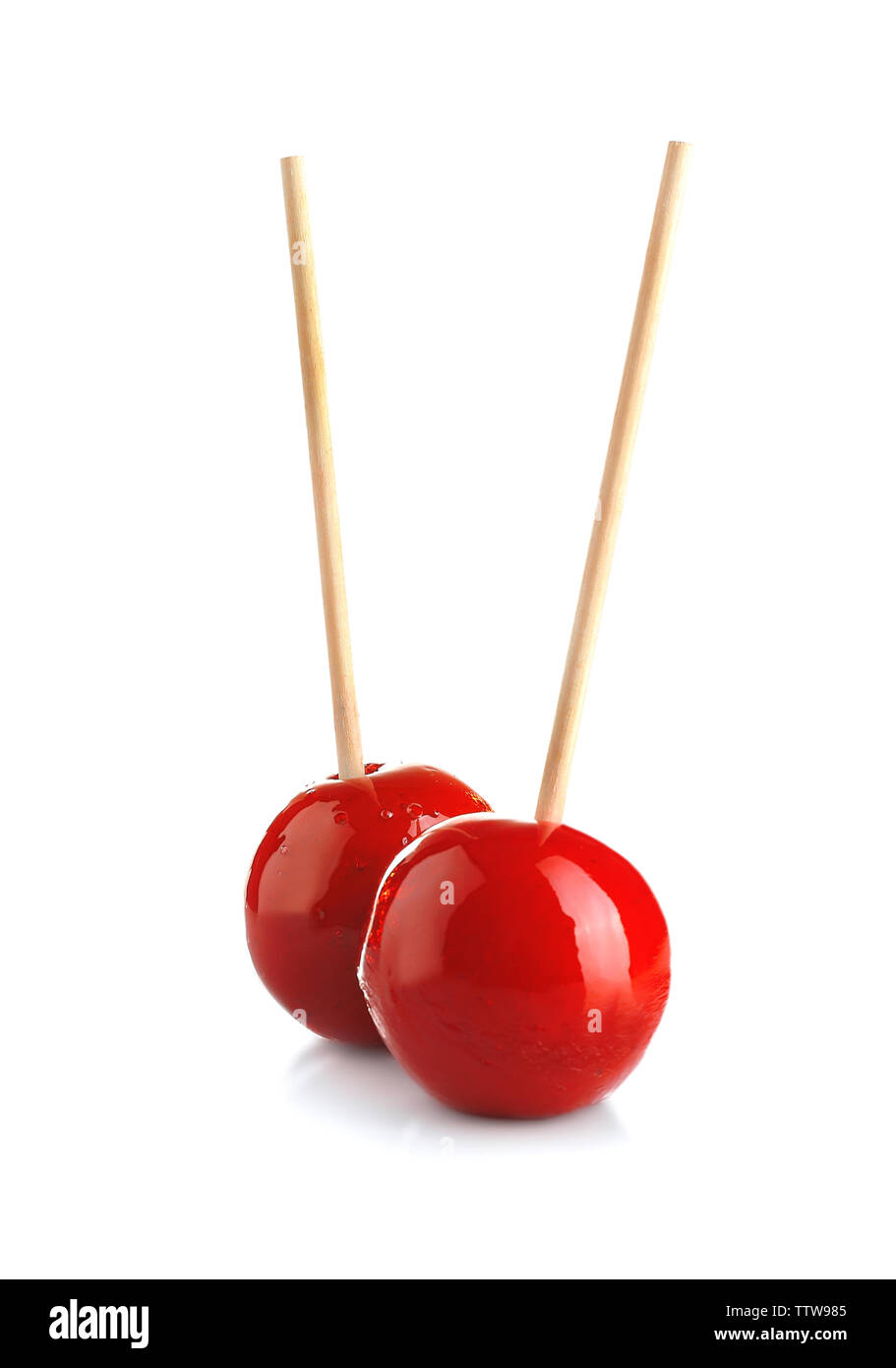 Toffee apples on white background Stock Photo - Alamy