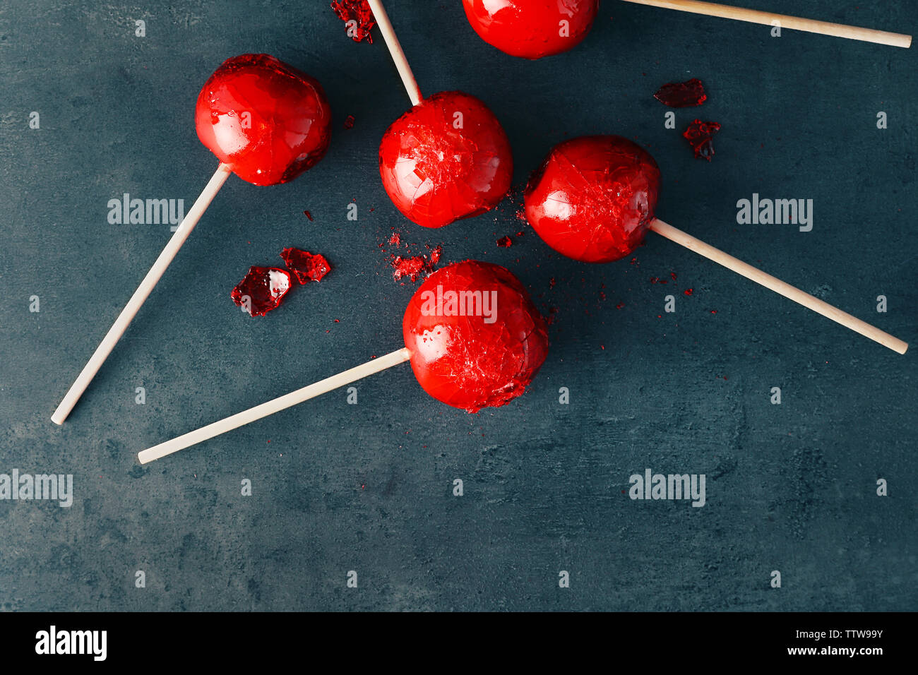 Toffee apples on grey background Stock Photo - Alamy