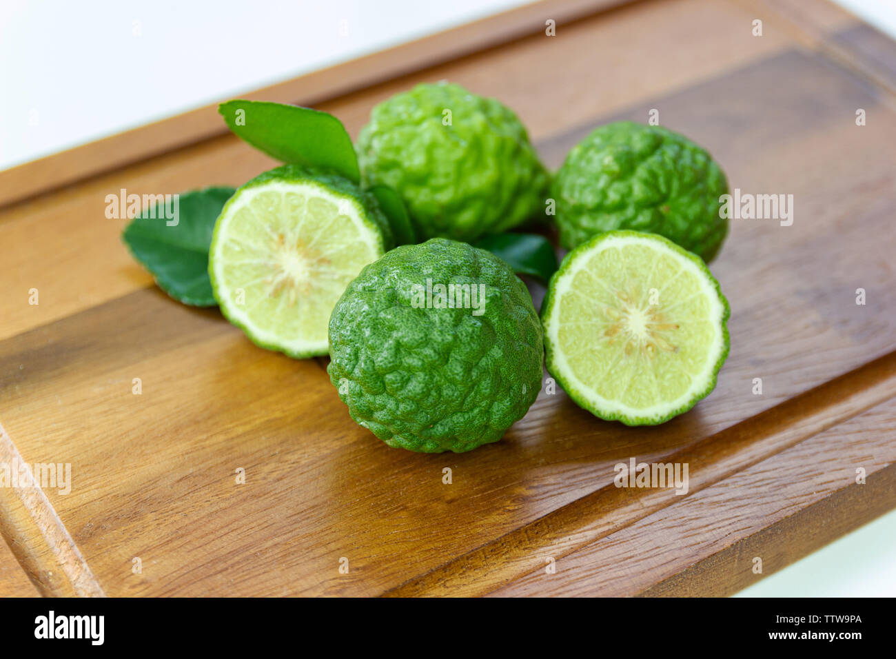 fresh fruits bergamot with cut in half on wood table Stock Photo - Alamy