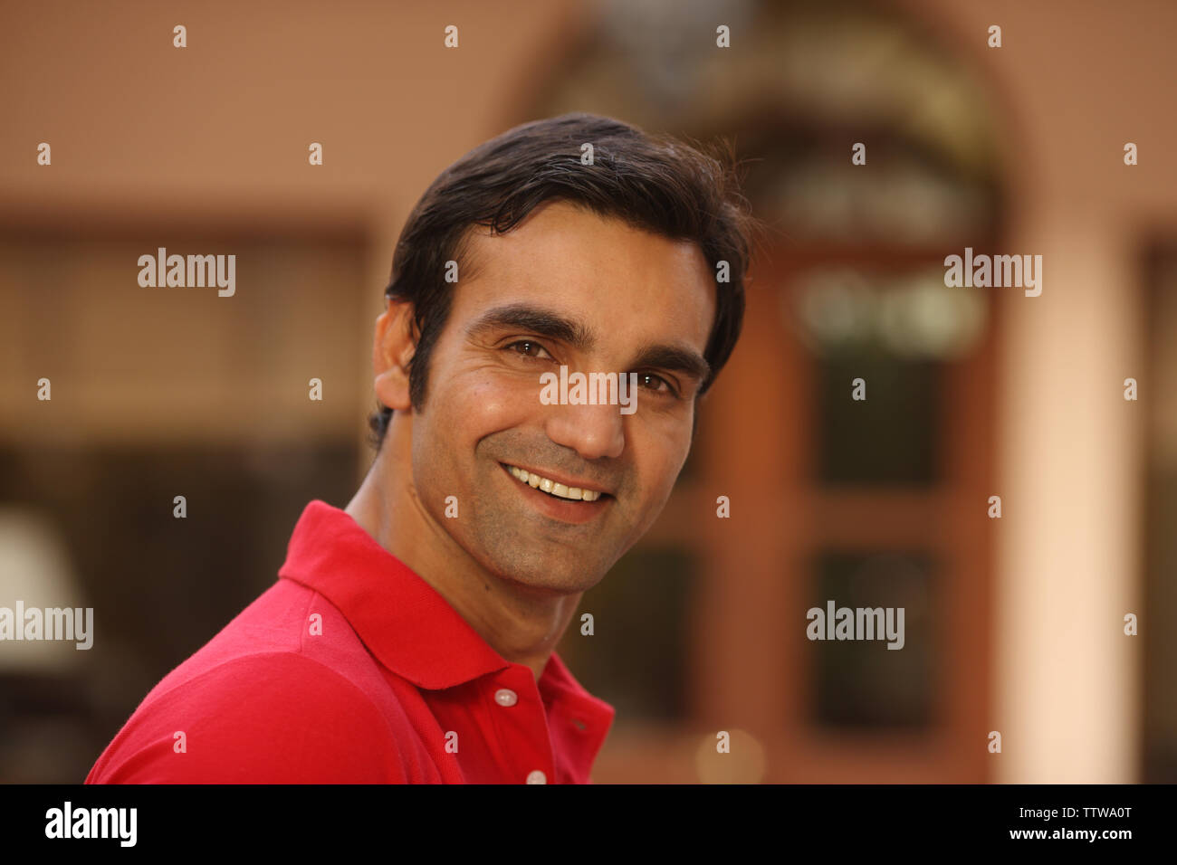 Portrait of an Indian young man smiling Stock Photo - Alamy