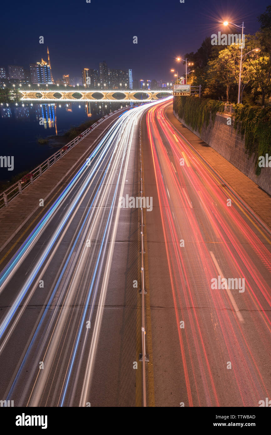 Lighting night view of cross-river bridge in Fushun city, China in ...