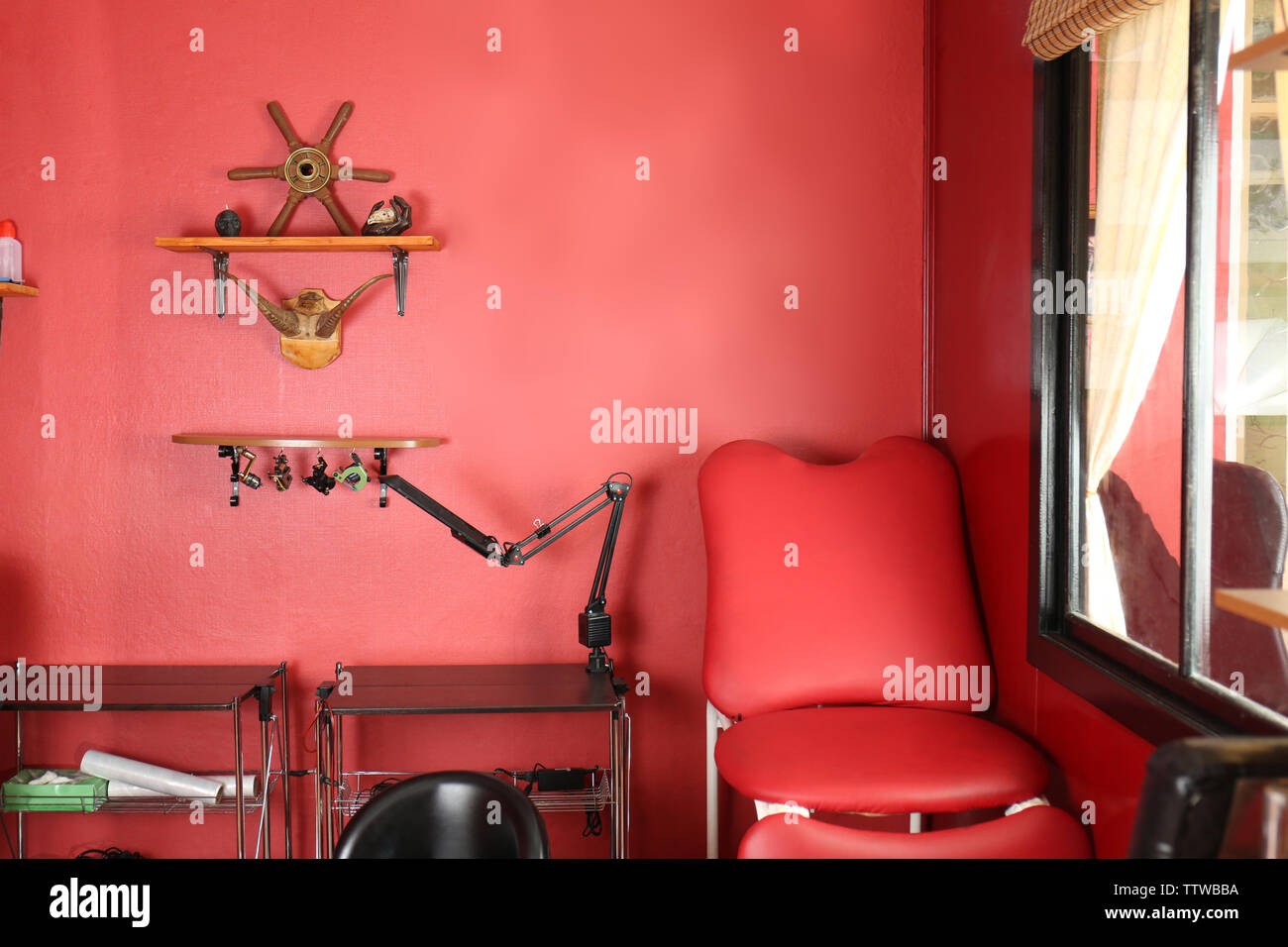 Creative interior of tattoo master studio Stock Photo - Alamy