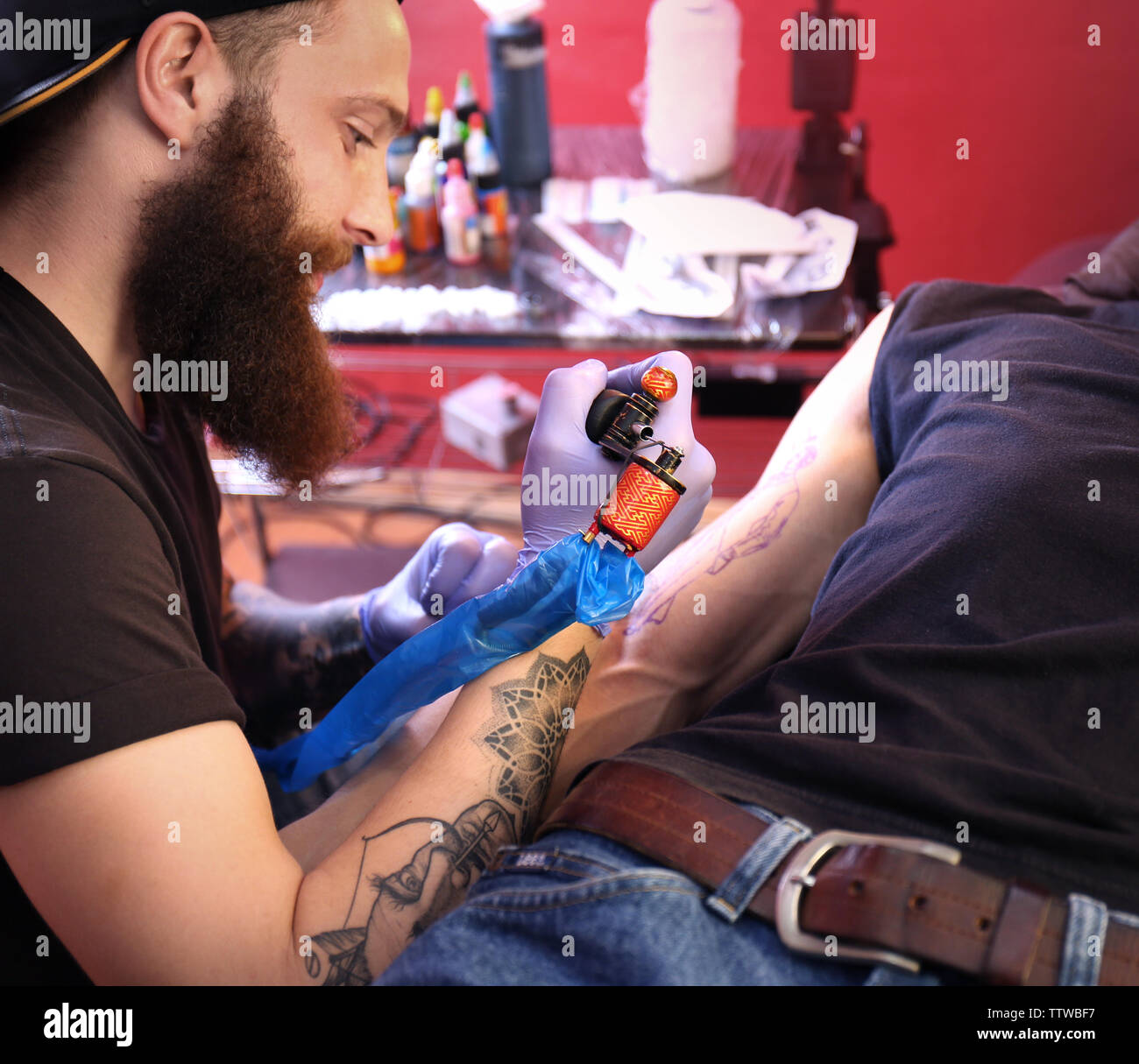 Professional artist making tattoo in salon, close up view Stock Photo ...