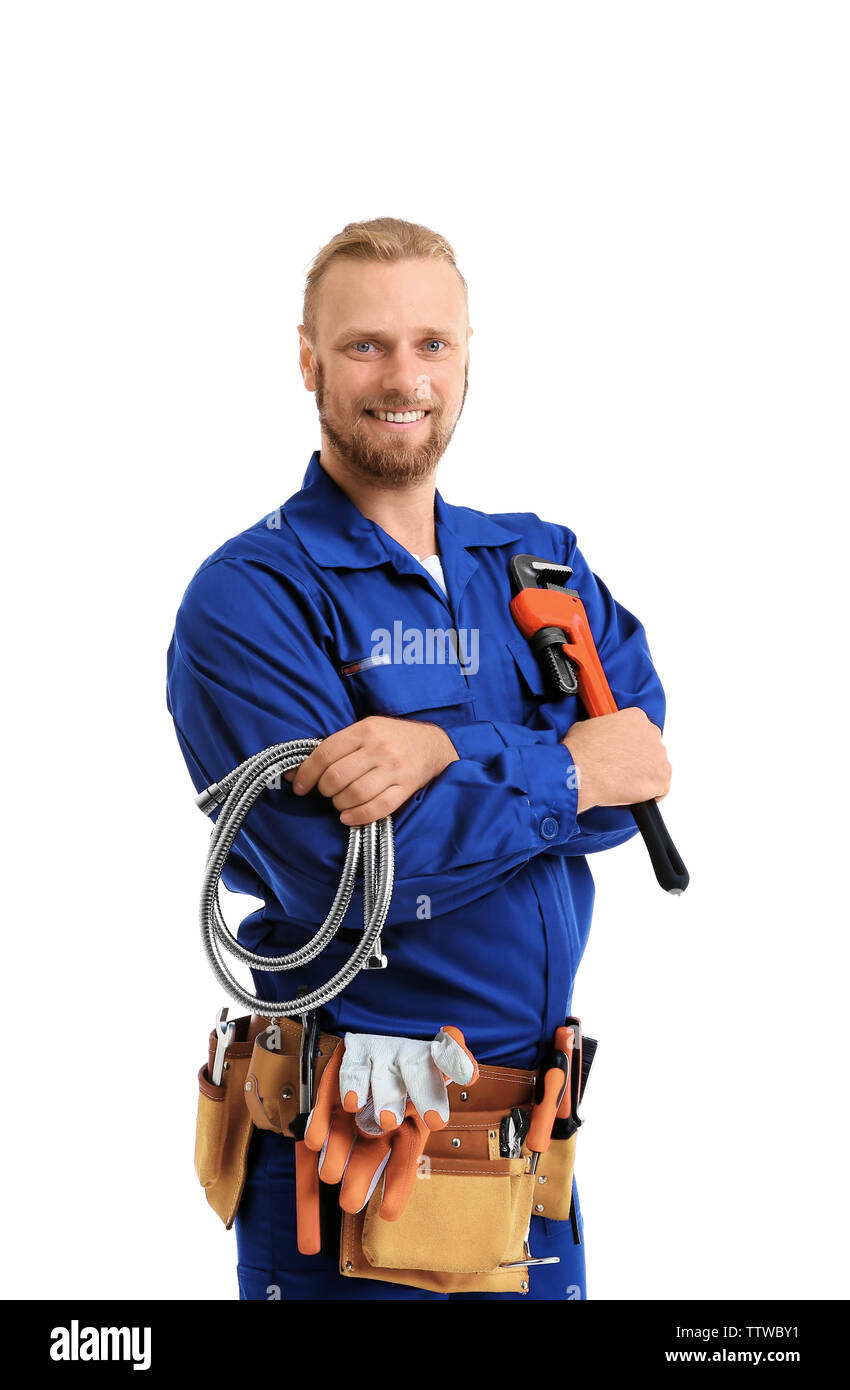Handsome plumber with pipe wrench and flexible hose isolated on white ...