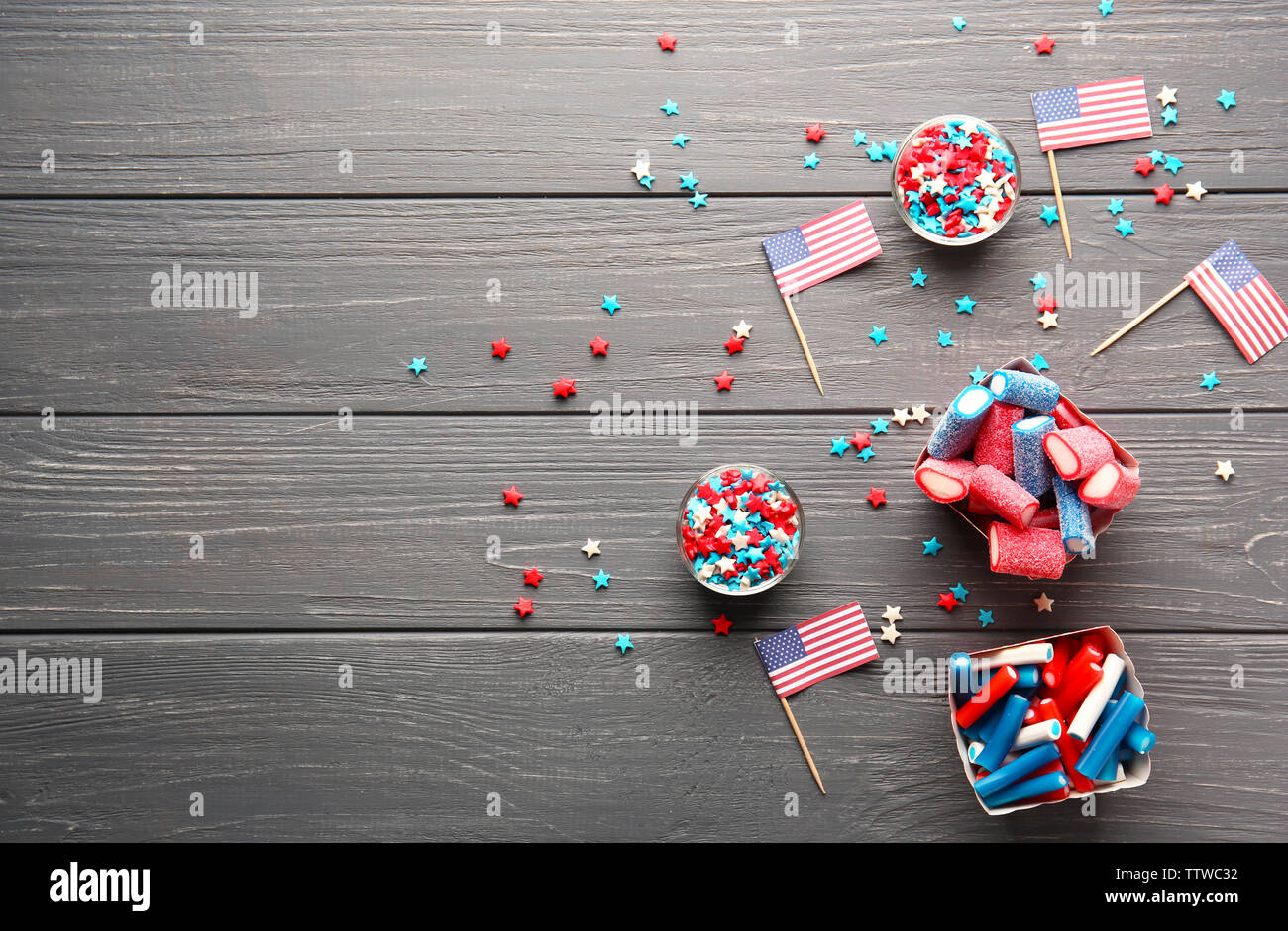 Assortment of sweets with USA flags on dark wooden background Stock ...