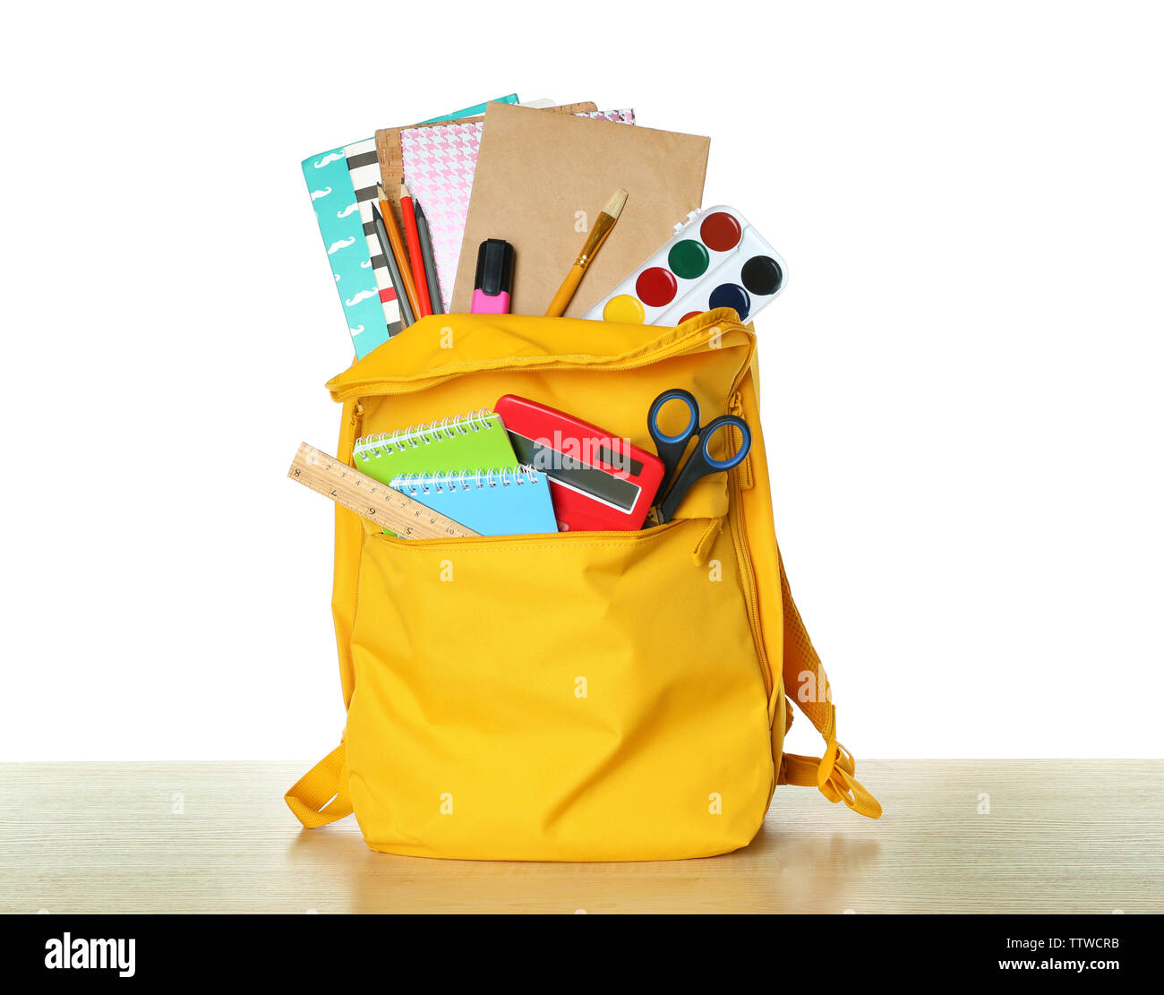 Yellow school backpack isolated on white Stock Photo - Alamy