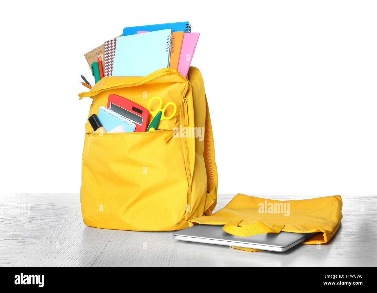 Yellow school backpack isolated on white Stock Photo - Alamy