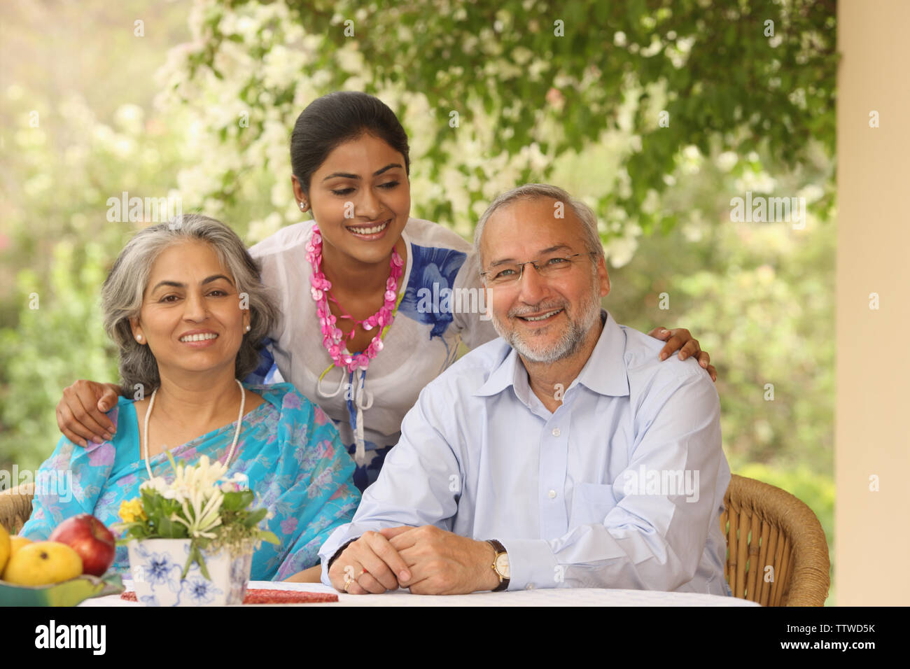 Woman with her parents at patio Stock Photo - Alamy