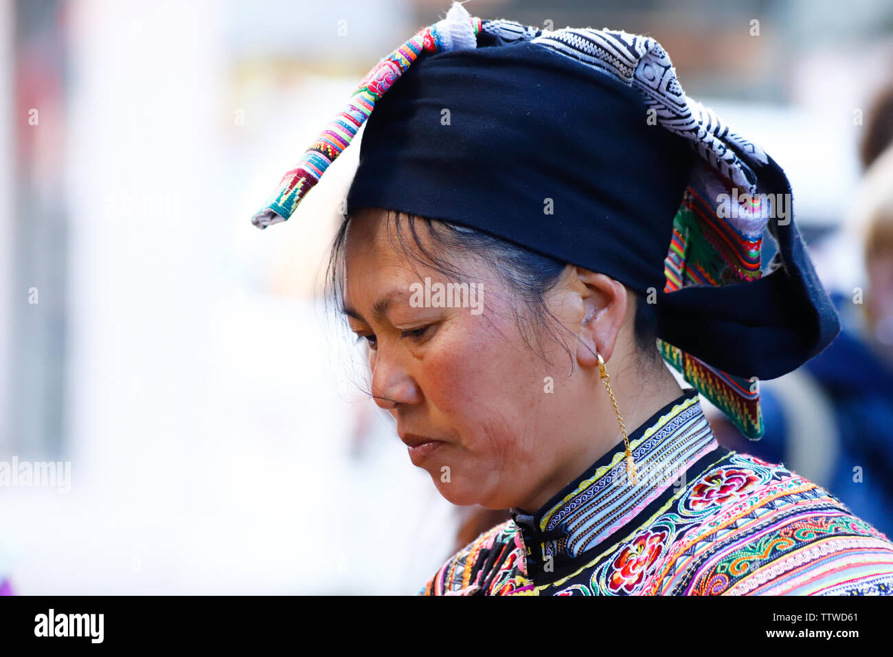 A woman in typical clothes in a village in southern Yunnan, China ...
