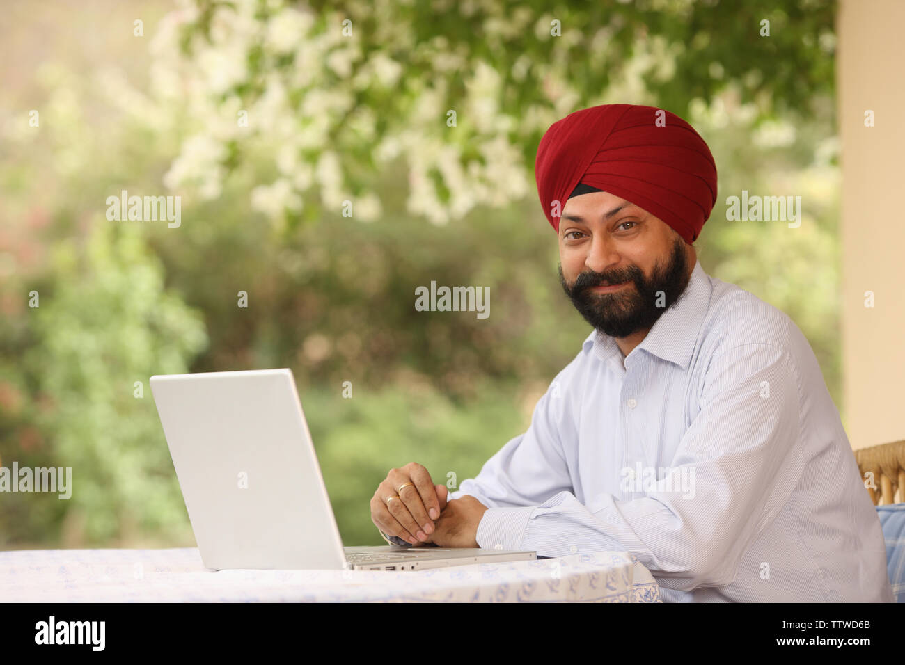Man working on a laptop Stock Photo - Alamy