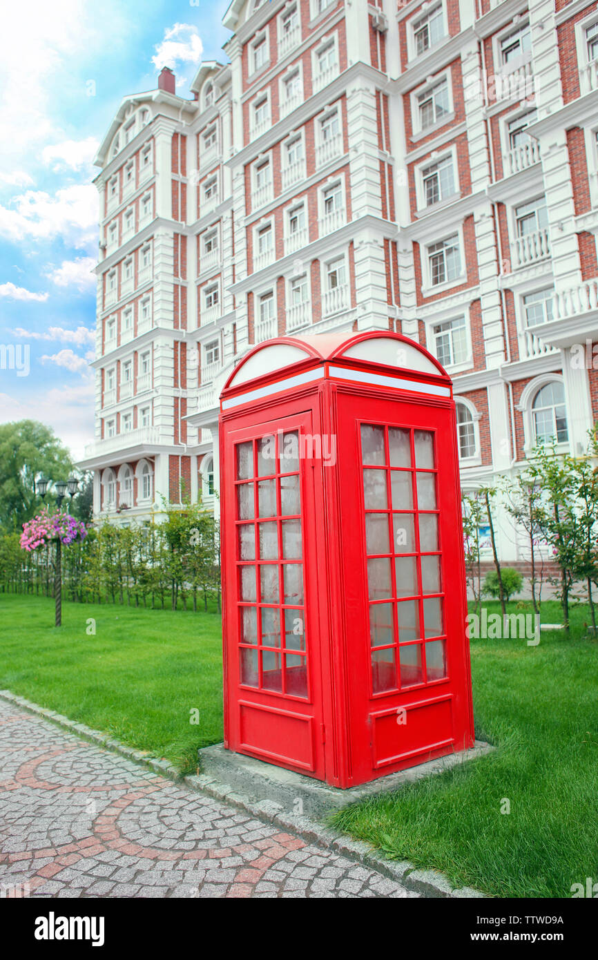 Red Telephone booth on city street Stock Photo - Alamy