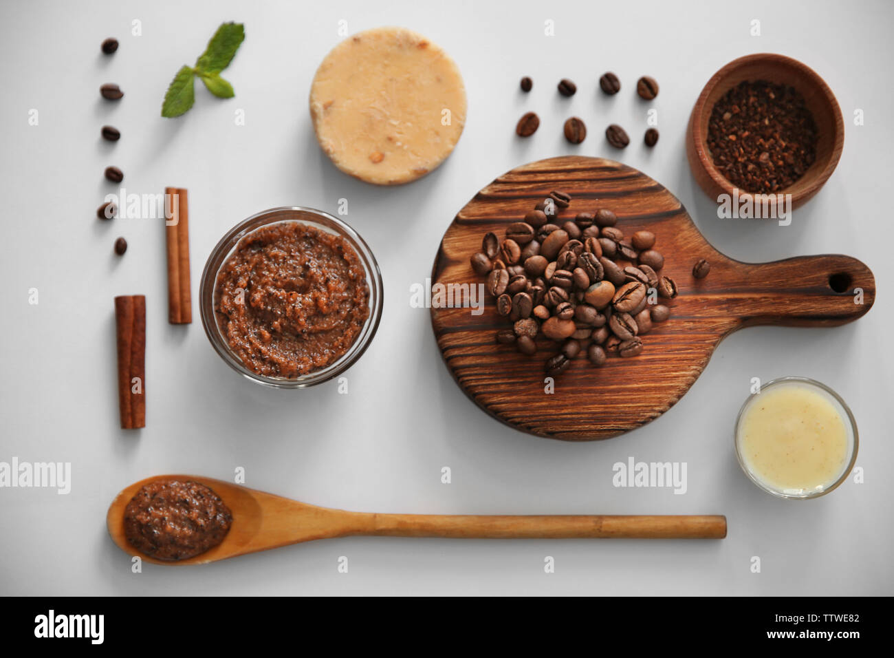 Coffee body scrub and soap on white background Stock Photo - Alamy