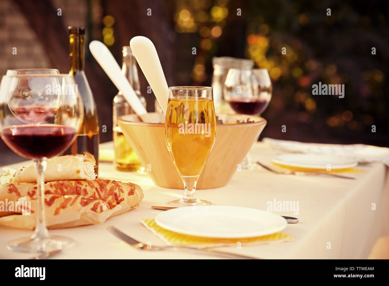 Table with food and drinks served for picnic Stock Photo - Alamy