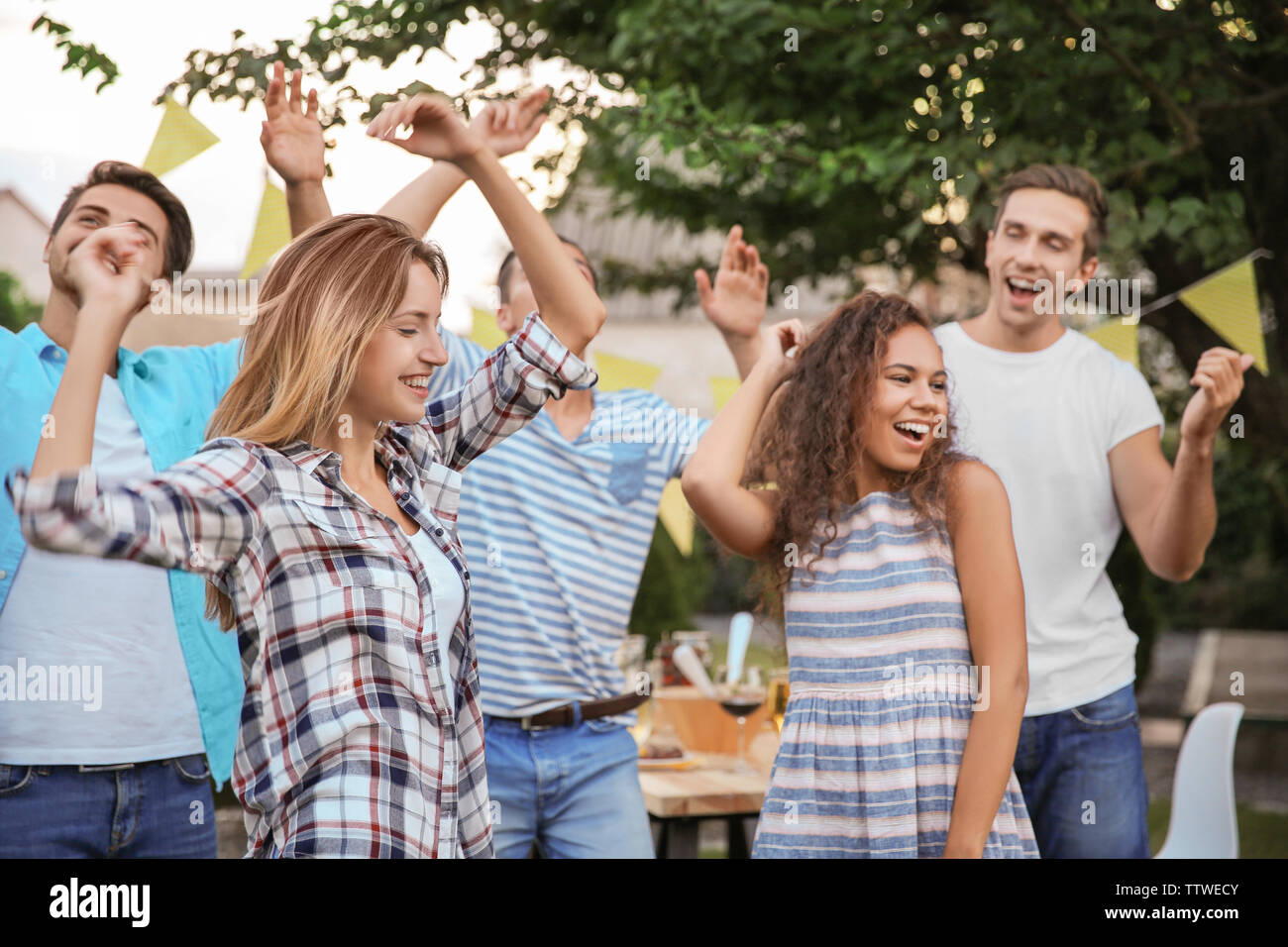 Young friends dancing at party outdoors Stock Photo - Alamy
