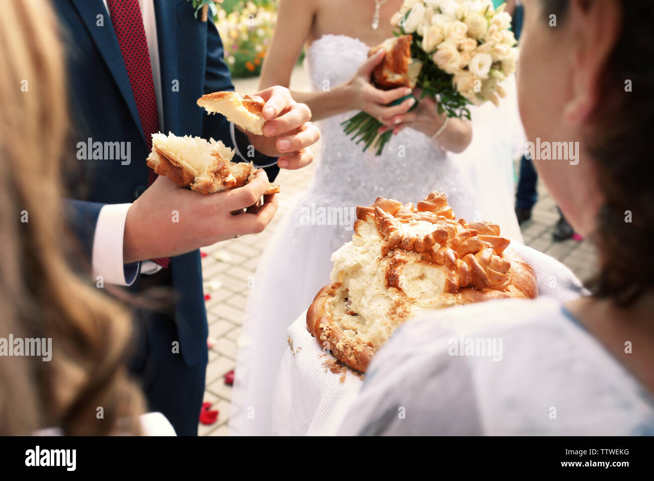 Traditional wedding bread with salt. Groom holding piece of bread Stock ...