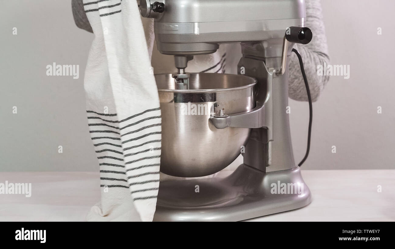 Step by step. Flat lay. Mixing royal icing in electric kitchen mixer ...