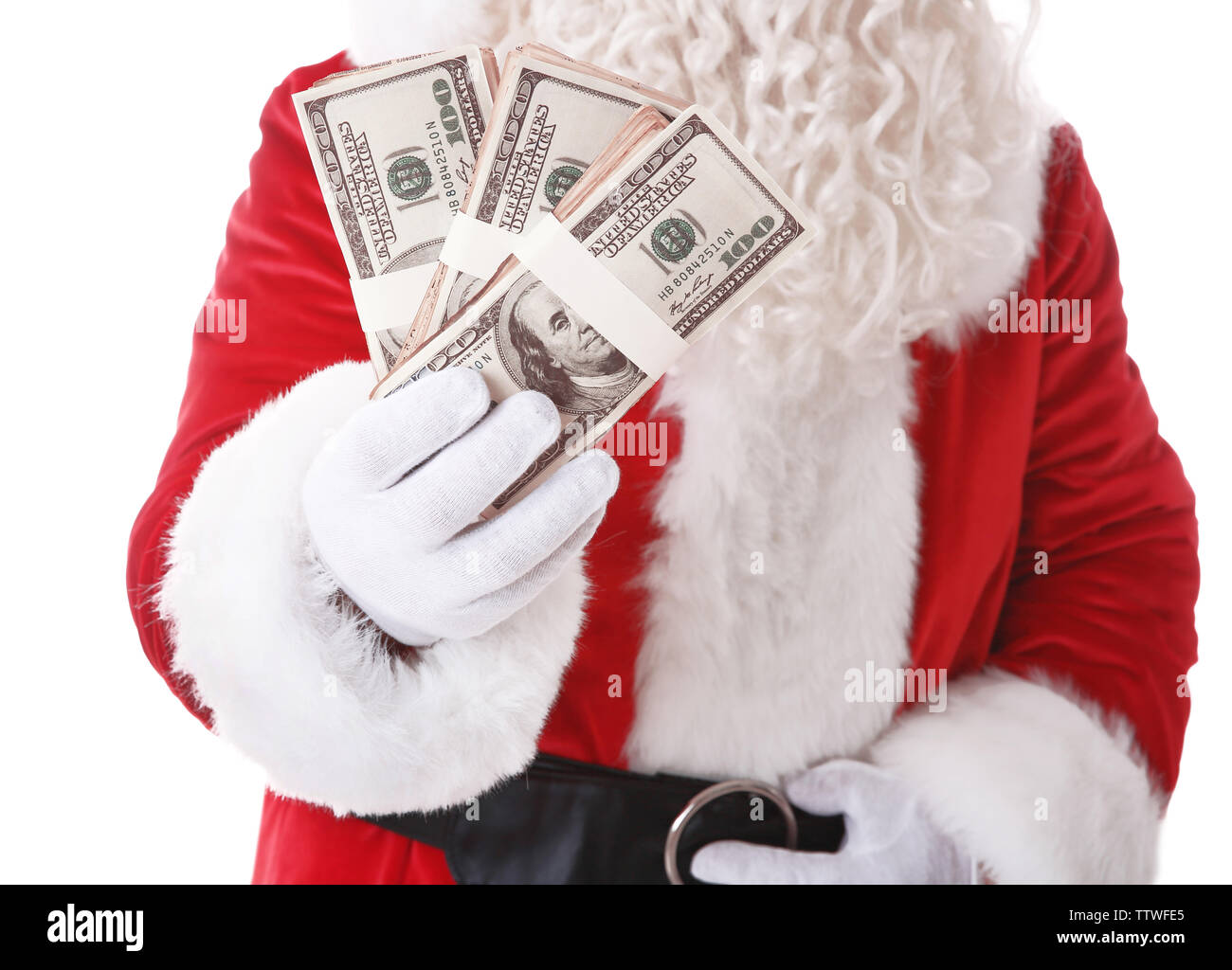 Santa Claus hand holding money on white background Stock Photo - Alamy