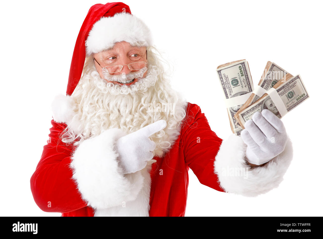 Santa Claus holding money on white background Stock Photo - Alamy