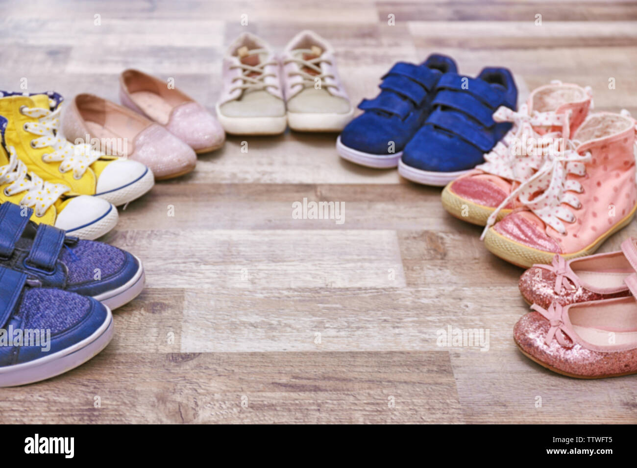 Colorful kids shoes on floor Stock Photo - Alamy