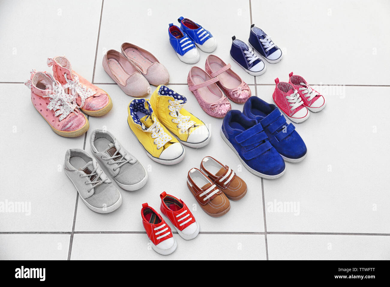 Colorful kids shoes on floor Stock Photo - Alamy