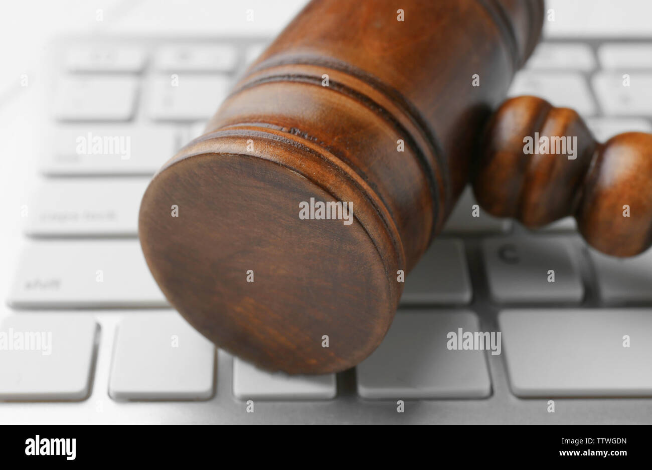 Wooden judge's gavel on computer keyboard, closeup Stock Photo - Alamy