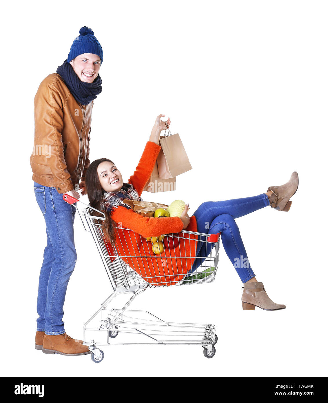 Young man carrying woman in trolley isolated on white Stock Photo - Alamy