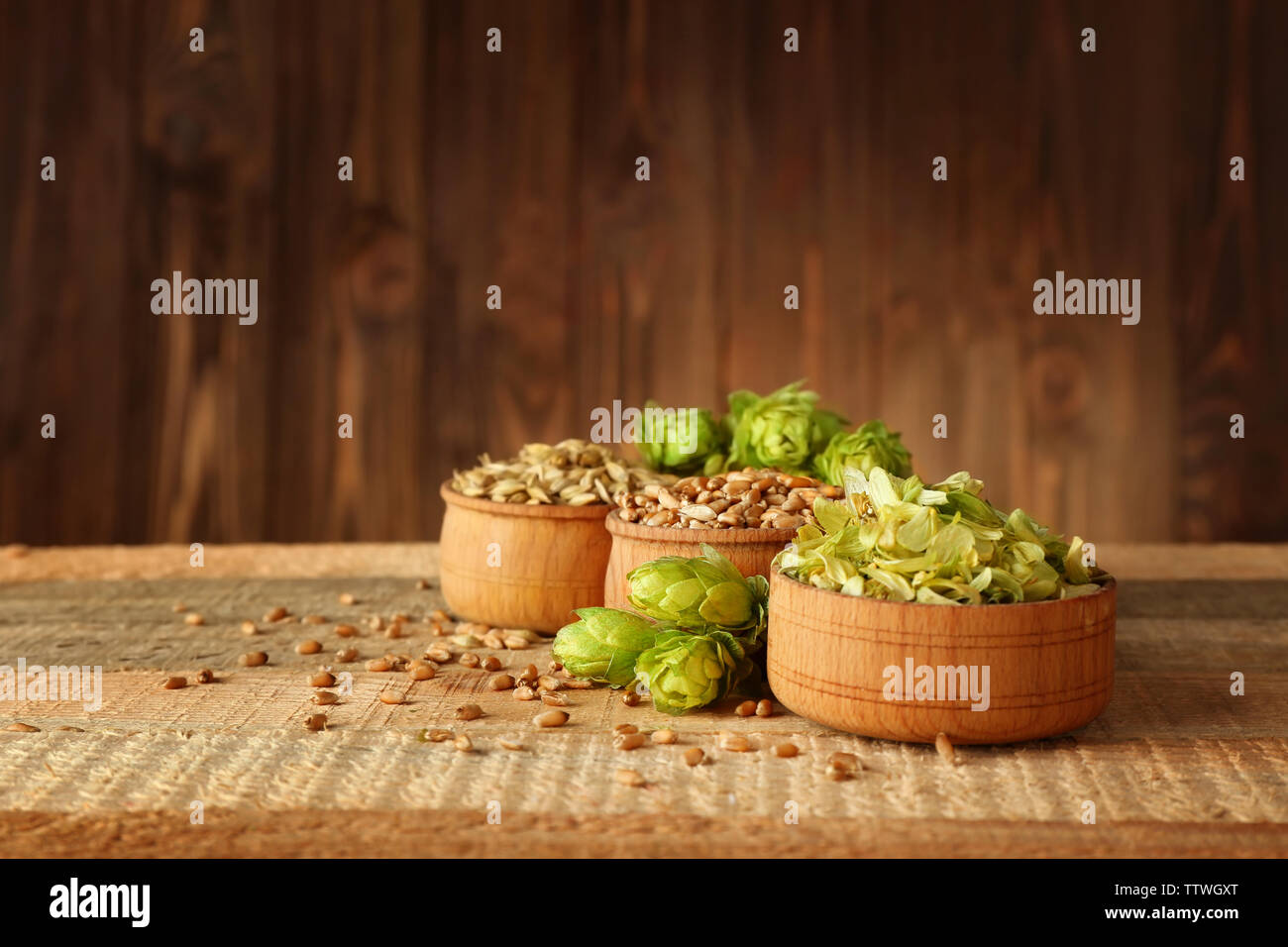 Beer ingredients on wooden background Stock Photo - Alamy