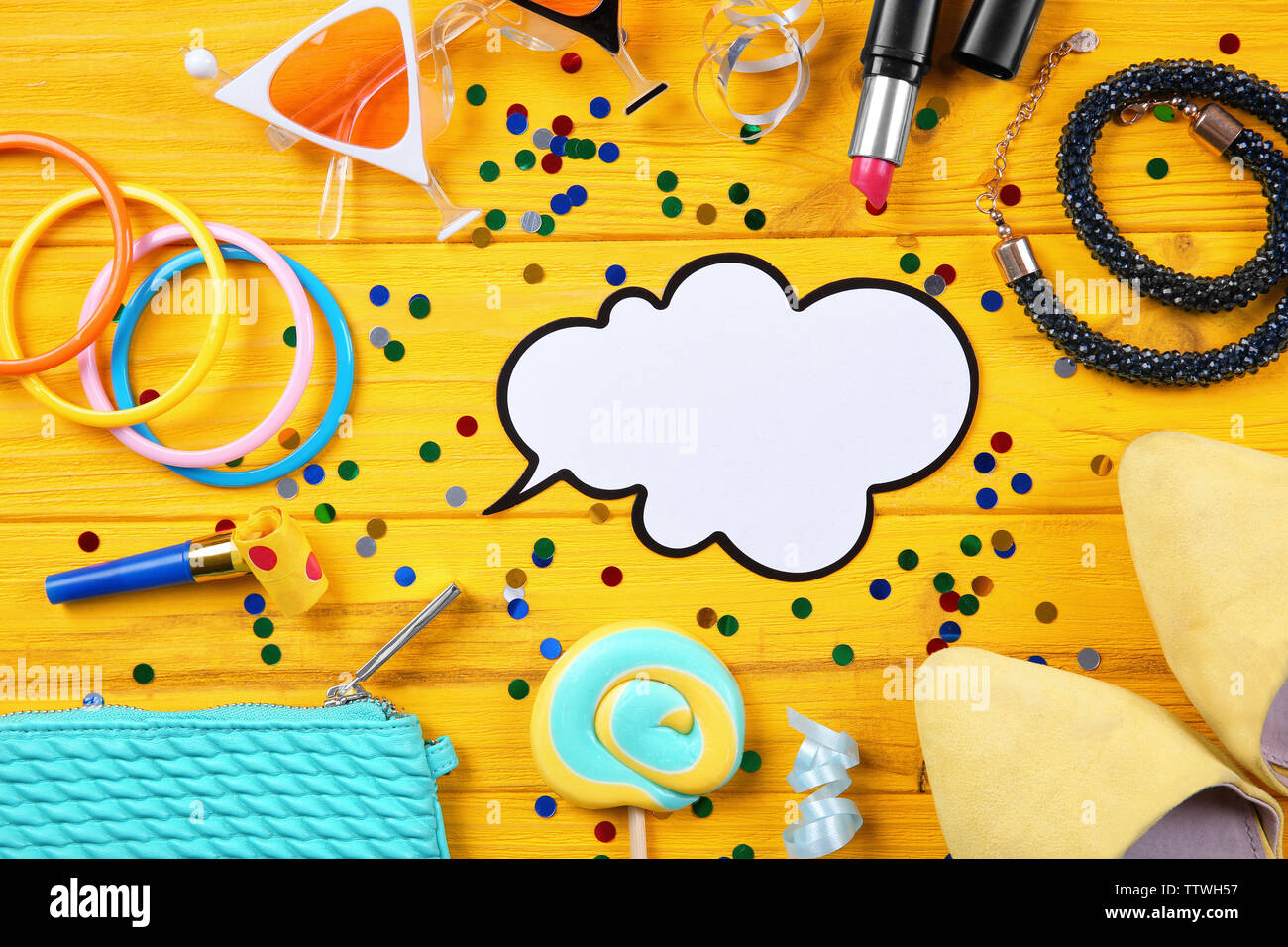 Flat lay. Festive objects on yellow wooden background Stock Photo - Alamy