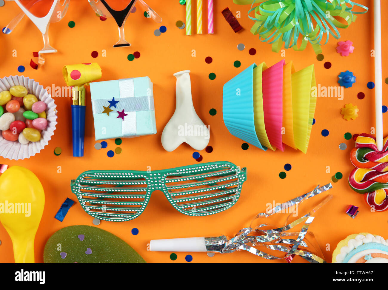 Flat lay. Festive objects on orange background Stock Photo - Alamy