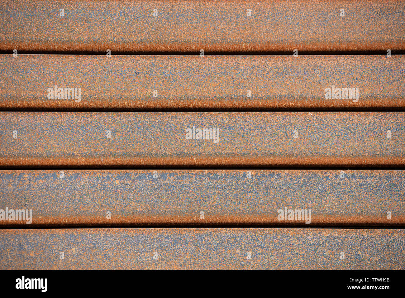 Rusty rectangular metal pipe in the packs are stored in the metal ...