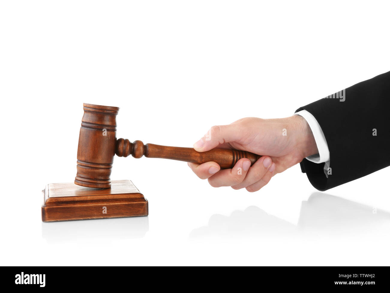 Judge's hand holding gavel on white background Stock Photo - Alamy